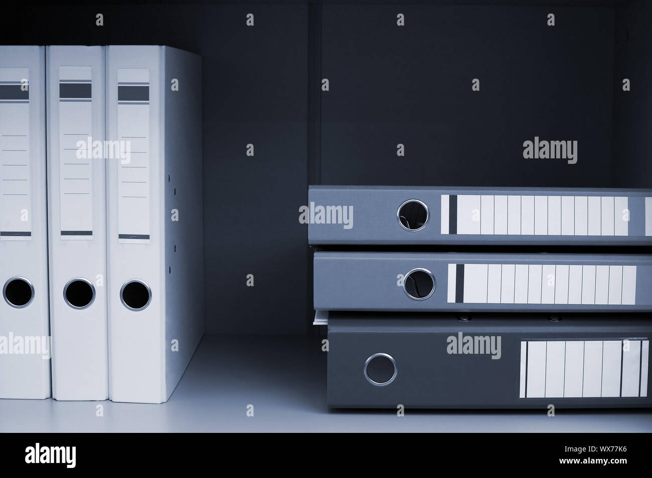 Folders for documents on book shelf Stock Photo - Alamy