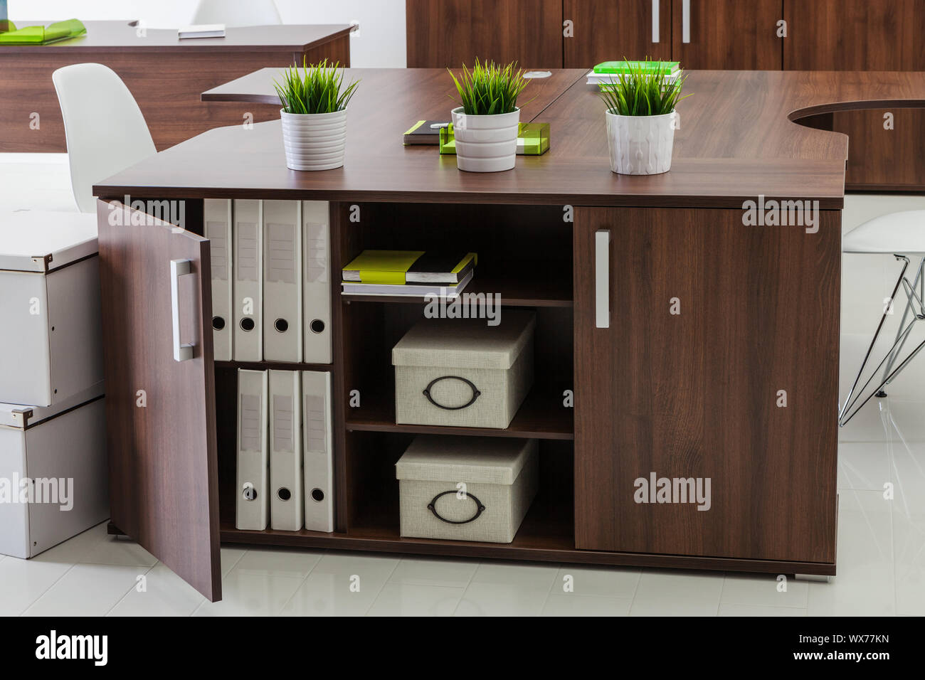 wooden tables and plants in a office Stock Photo - Alamy