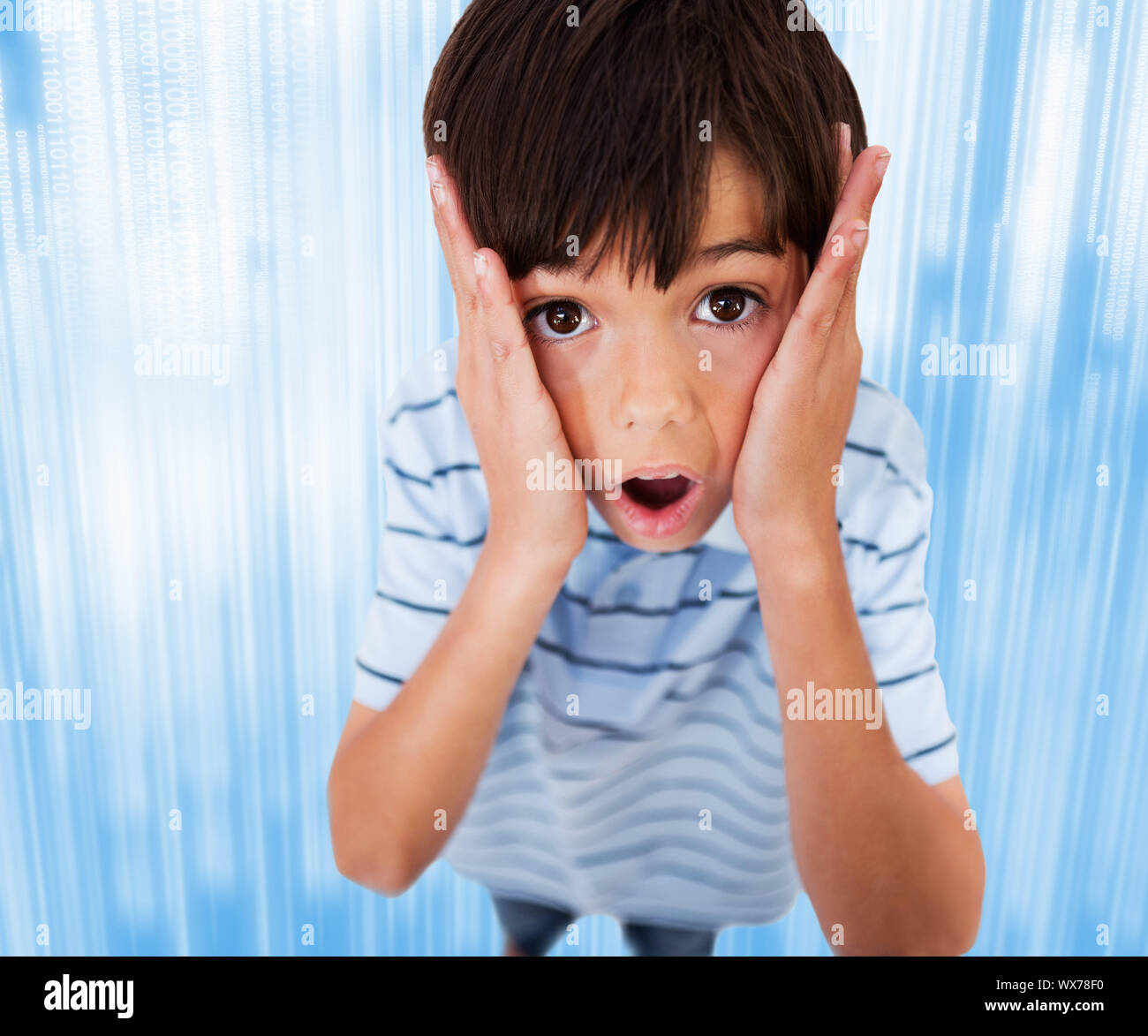 Boy standing while looking scared on blue digital background Stock ...