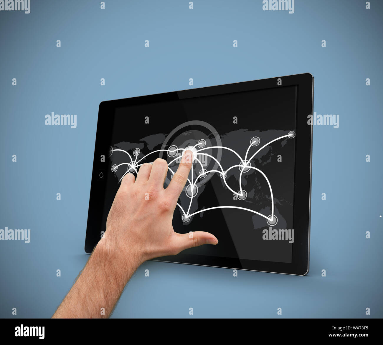 Finger pointing tablet pc with world map against blue background Stock ...