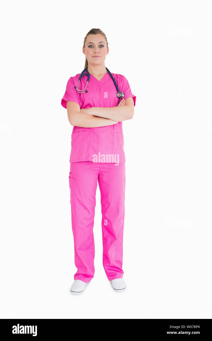 Doctor wearing pink scrubs with arms folded Stock Photo - Alamy