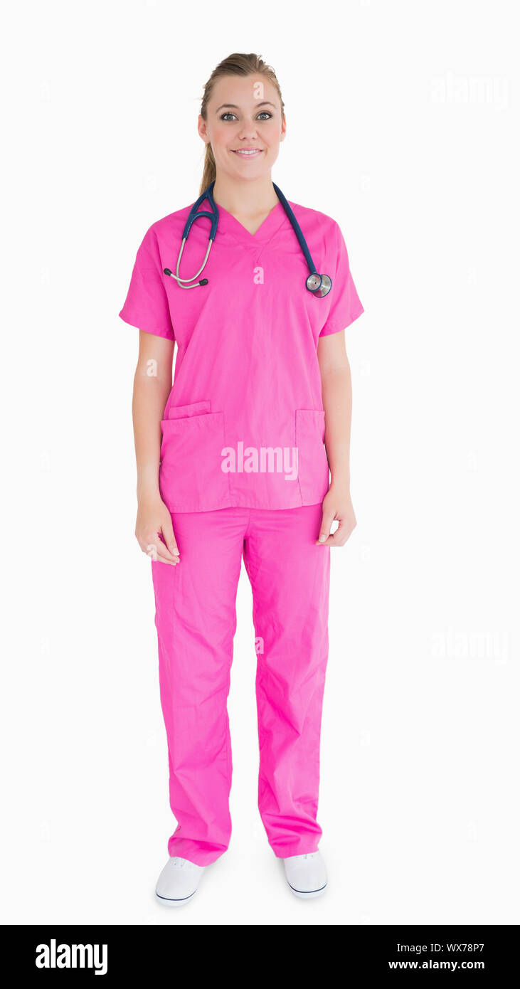 Smiling nurse wearing pink scrubs Stock Photo - Alamy
