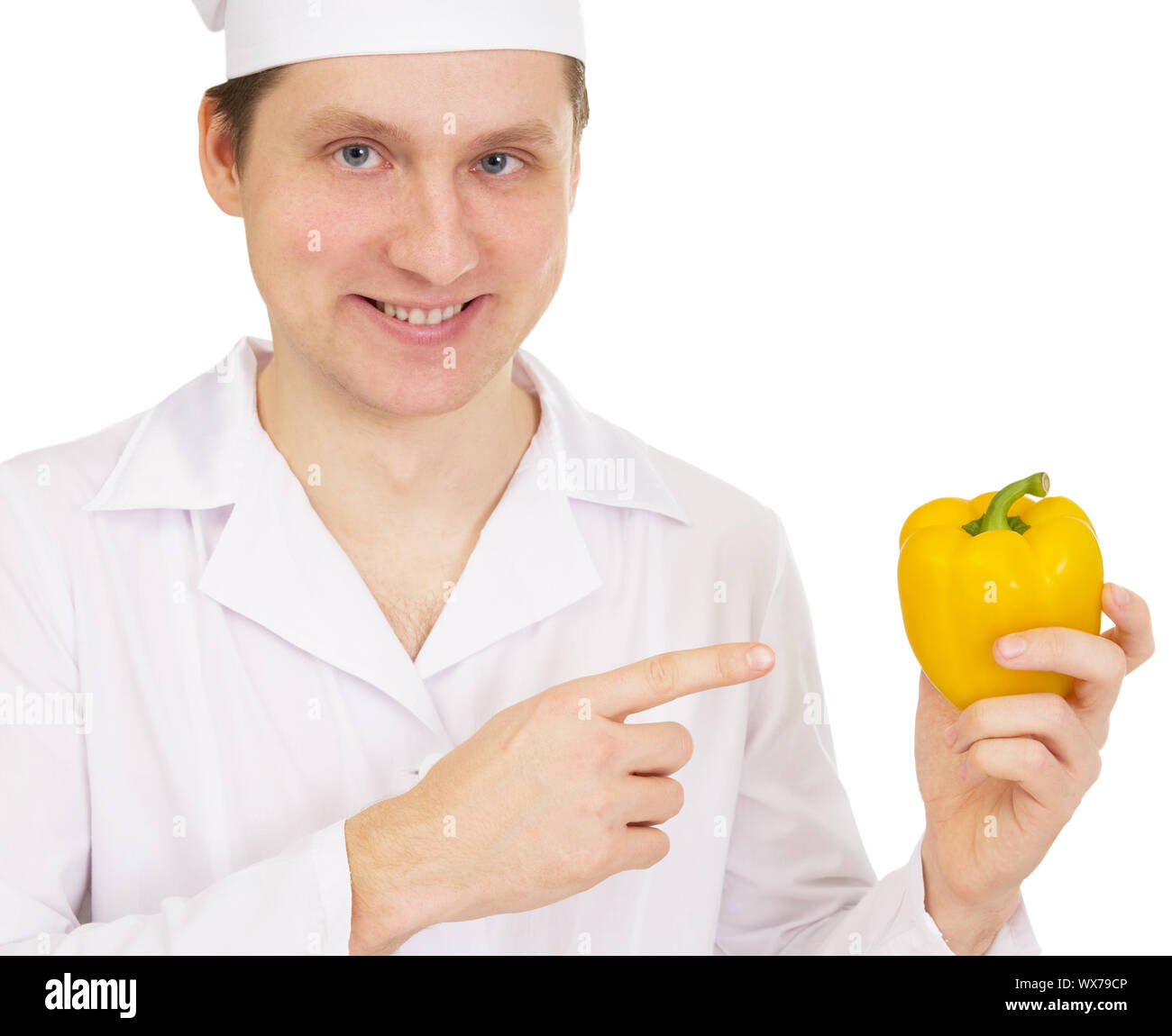 Cook in white overall with paprica in hand a white background Stock ...