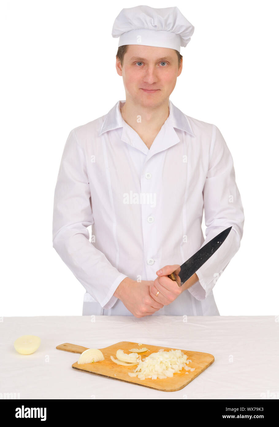 Cook in white overall with knife and preparation board on a white ...
