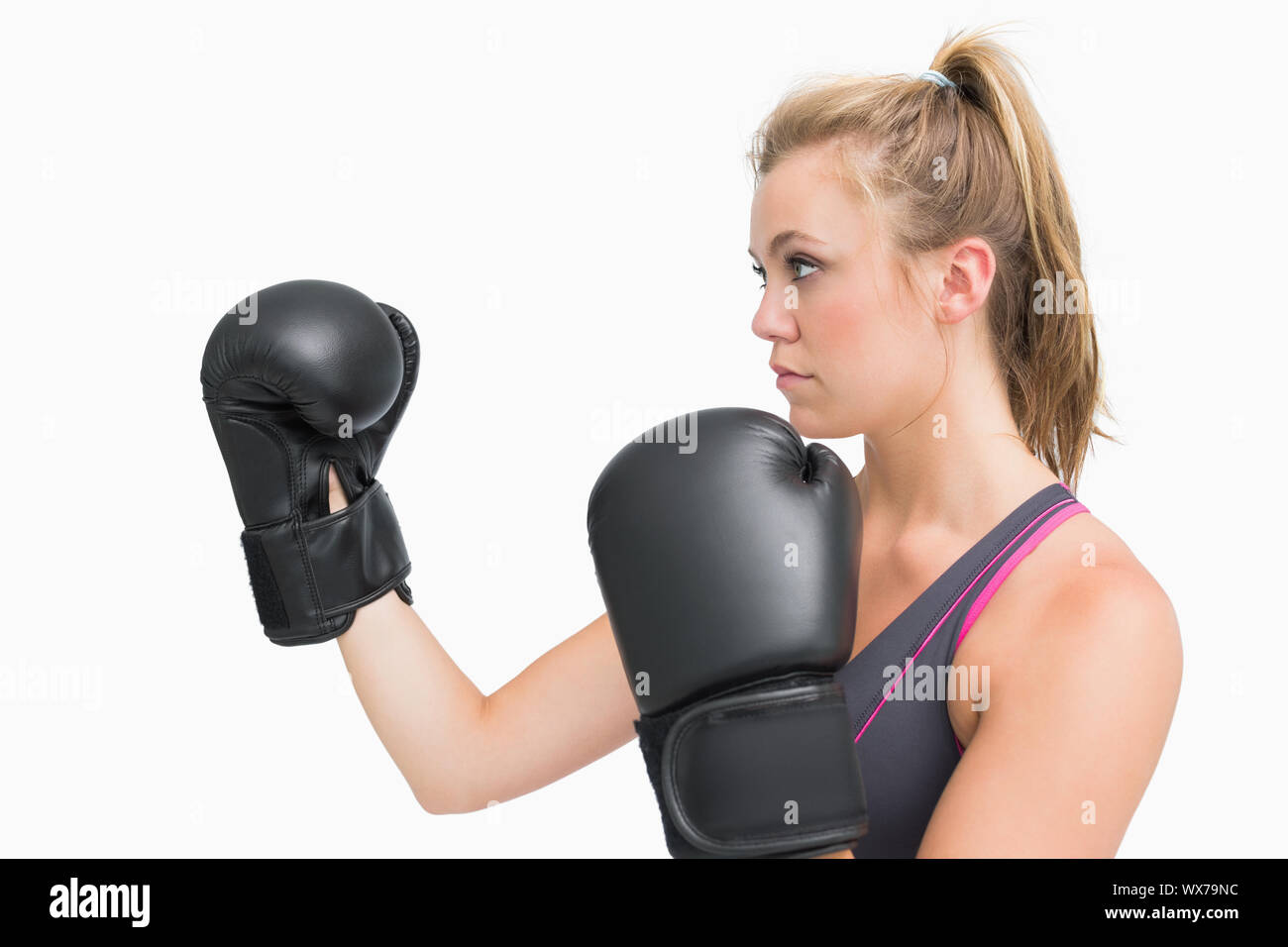 Female boxer in guard position looking tough Stock Photo - Alamy