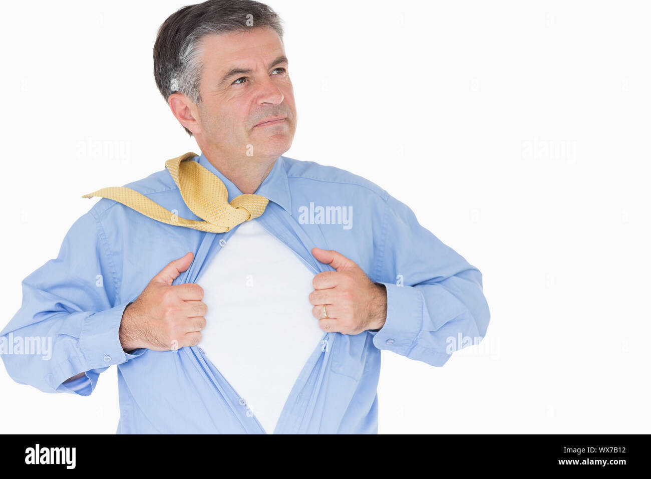 Serious man pulling his shirt with his hands like a superhero Stock ...