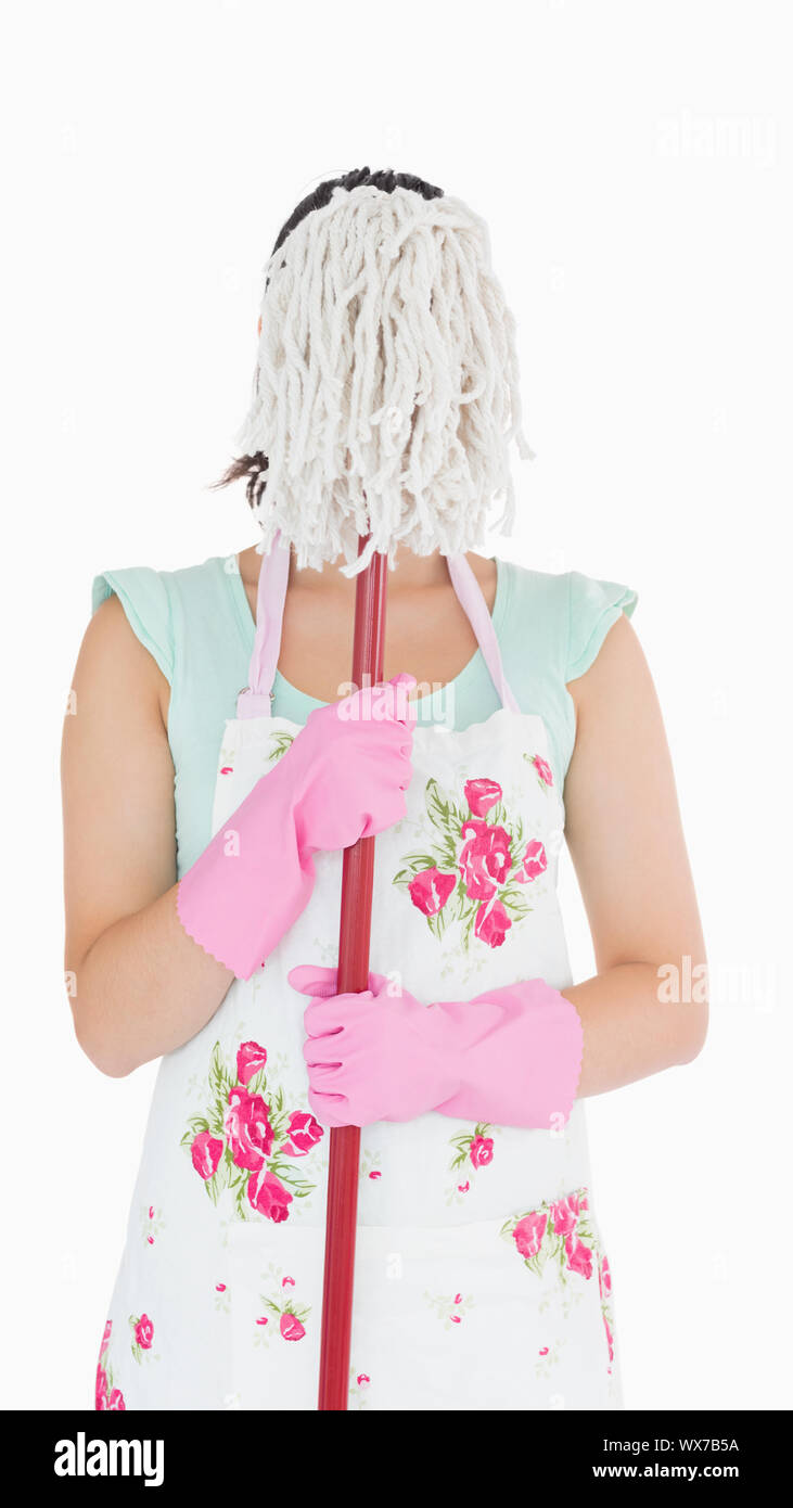 Woman hiding her face with a mop on a white background Stock Photo - Alamy