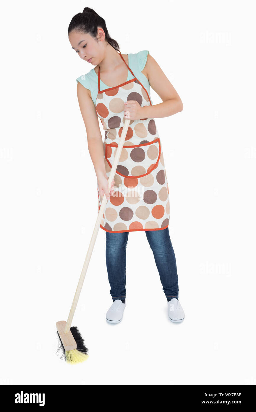 Woman sweeping the floor on a white background Stock Photo - Alamy