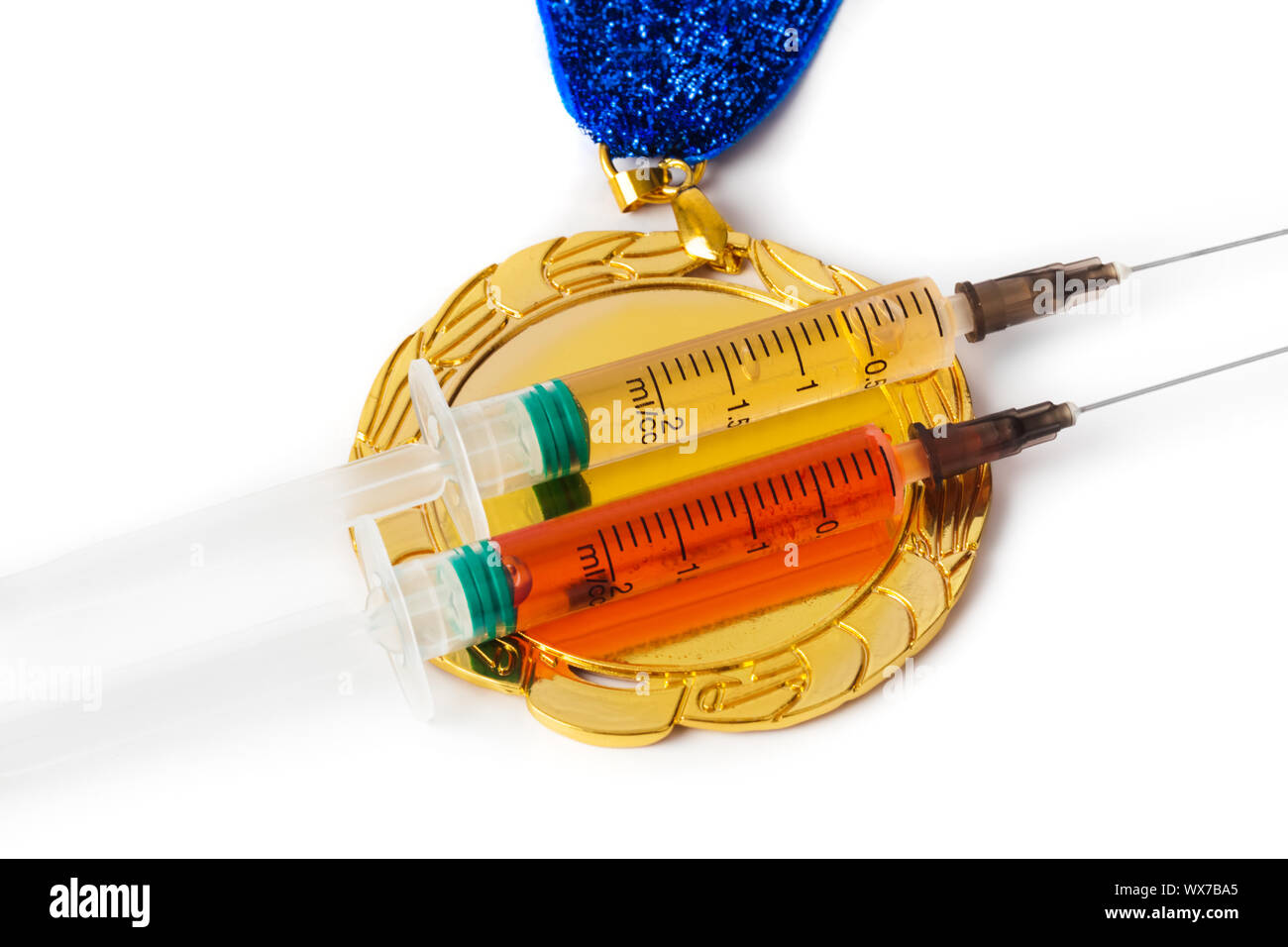 Gold medal and syringes Stock Photo - Alamy