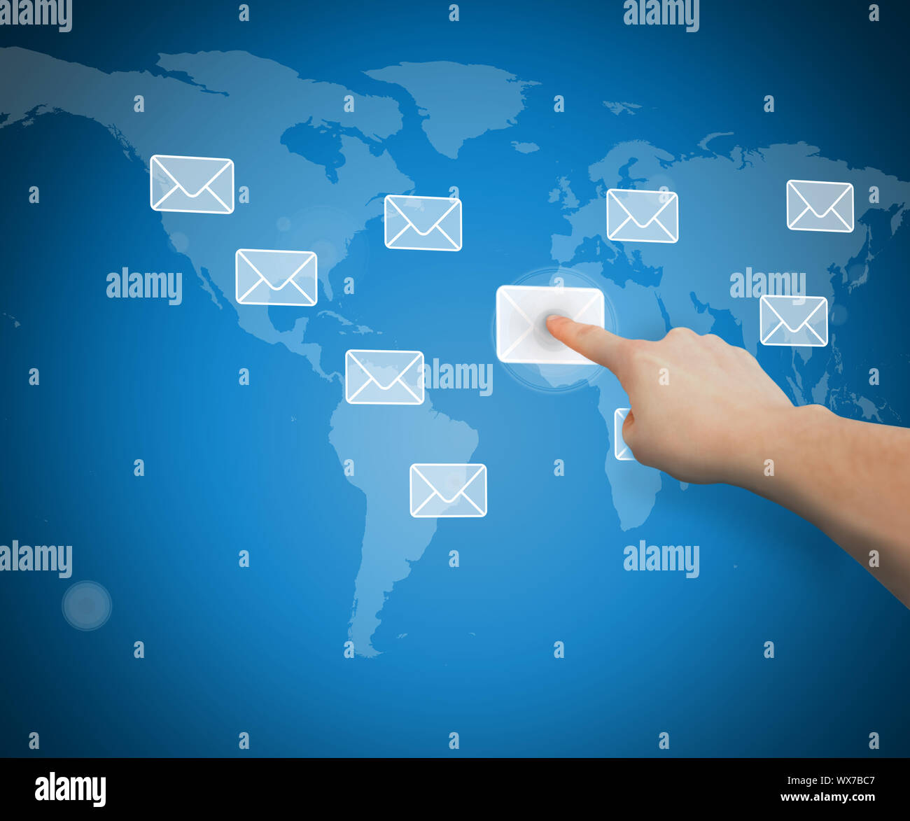 Hand selecting email from world map touchscreen interface Stock Photo ...