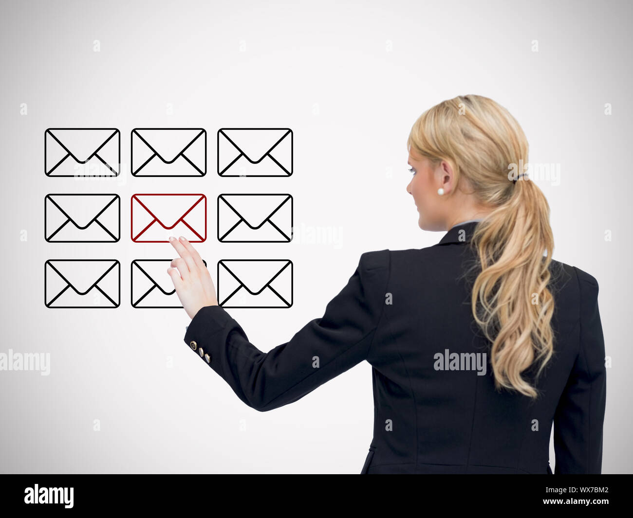 Businesswoman standing while touching at red message symbol against ...