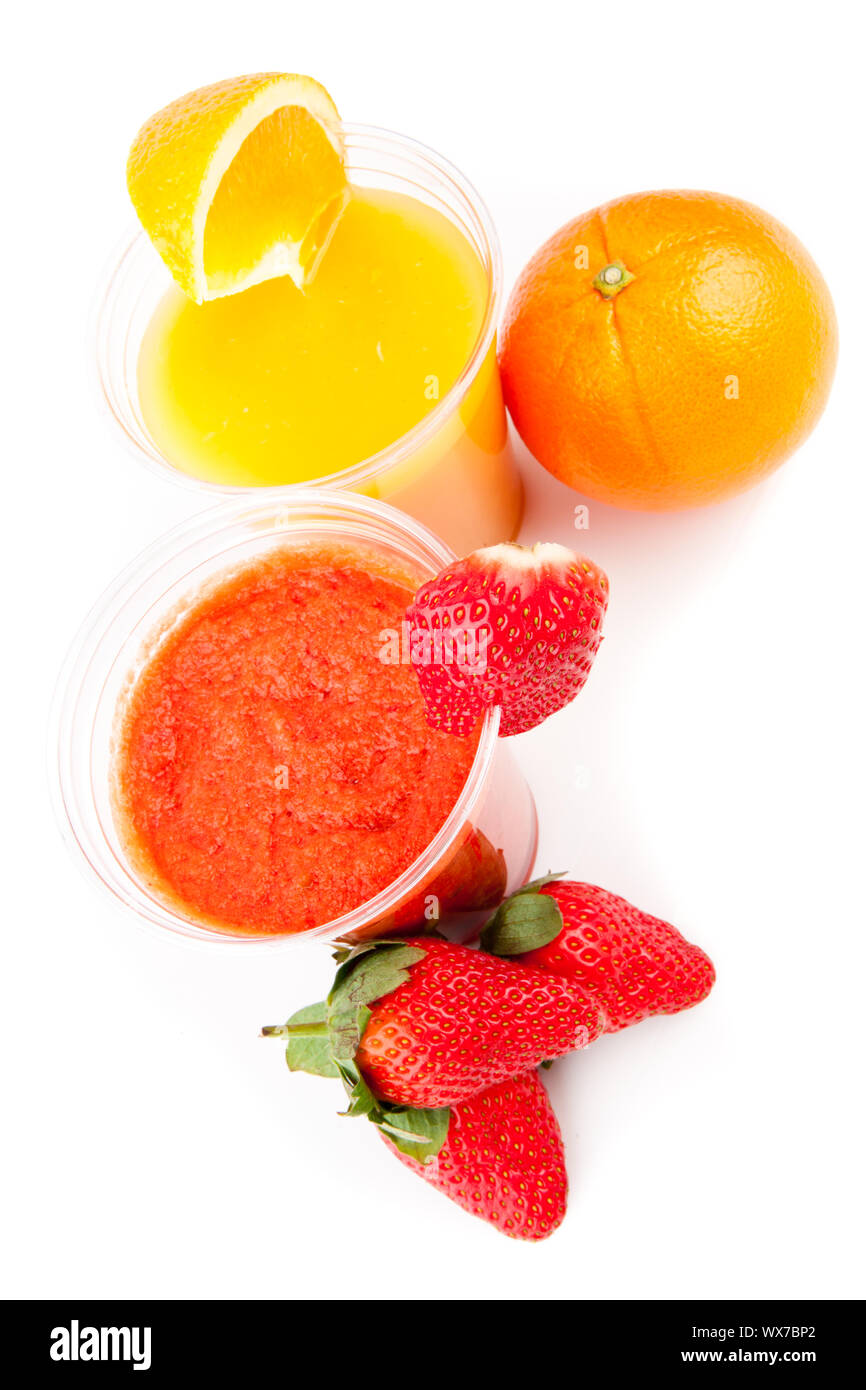 Orange and strawberry juice standing against white background Stock ...
