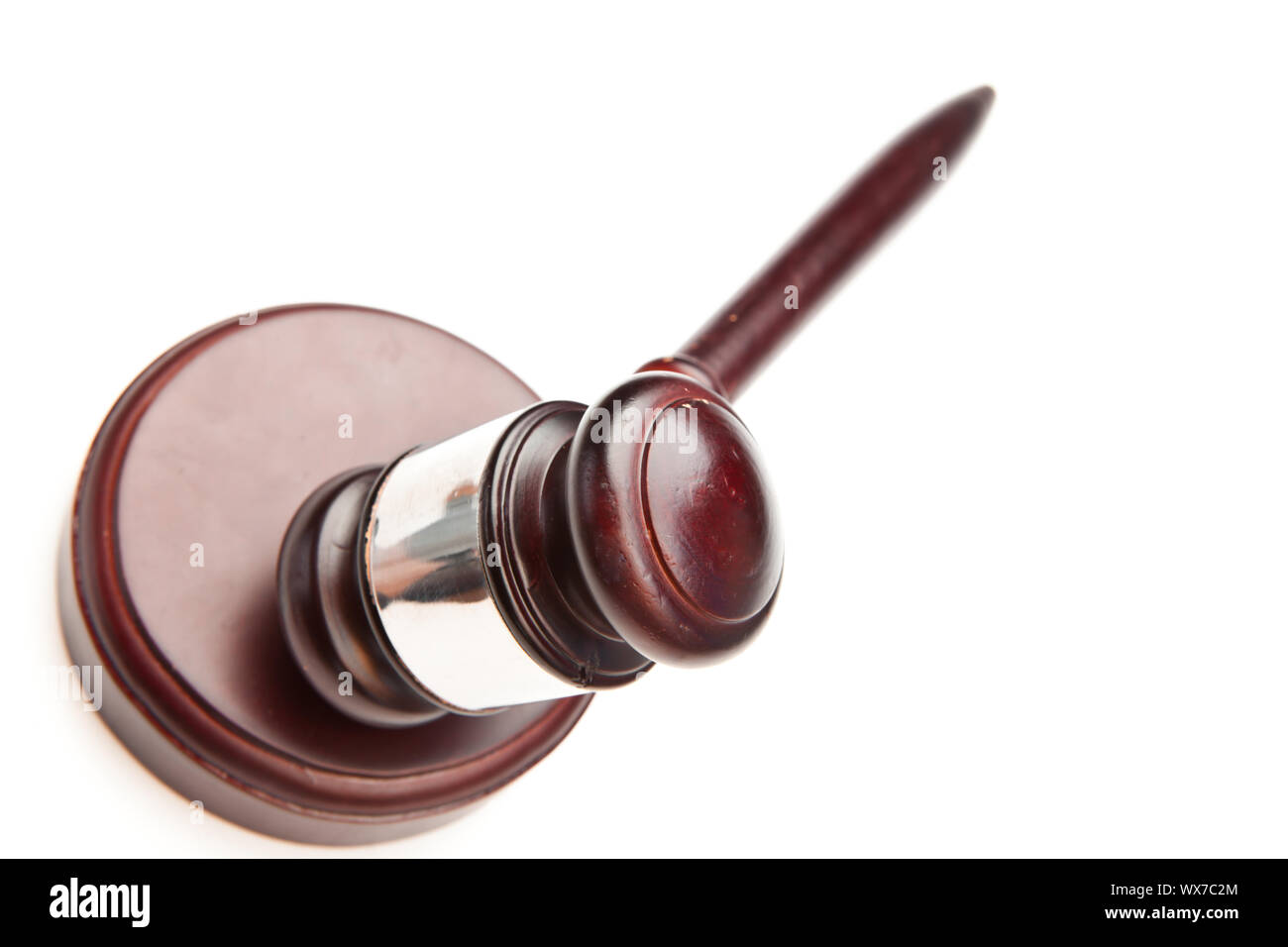 Brown wooden gavel lying against white background Stock Photo - Alamy