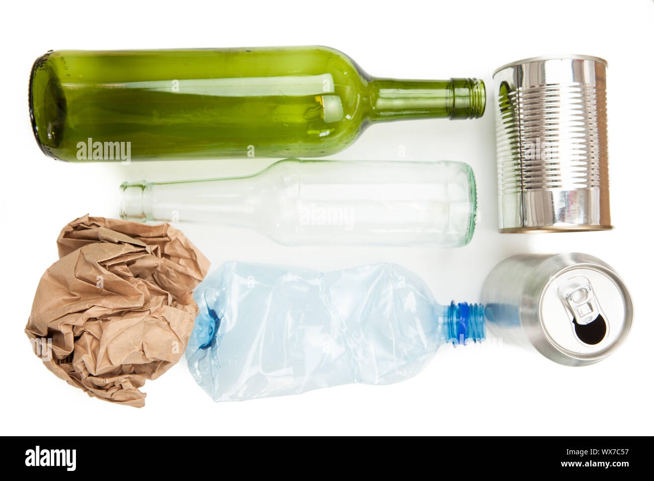 Plastic paper glass and mteallic recyclable waste on white background ...