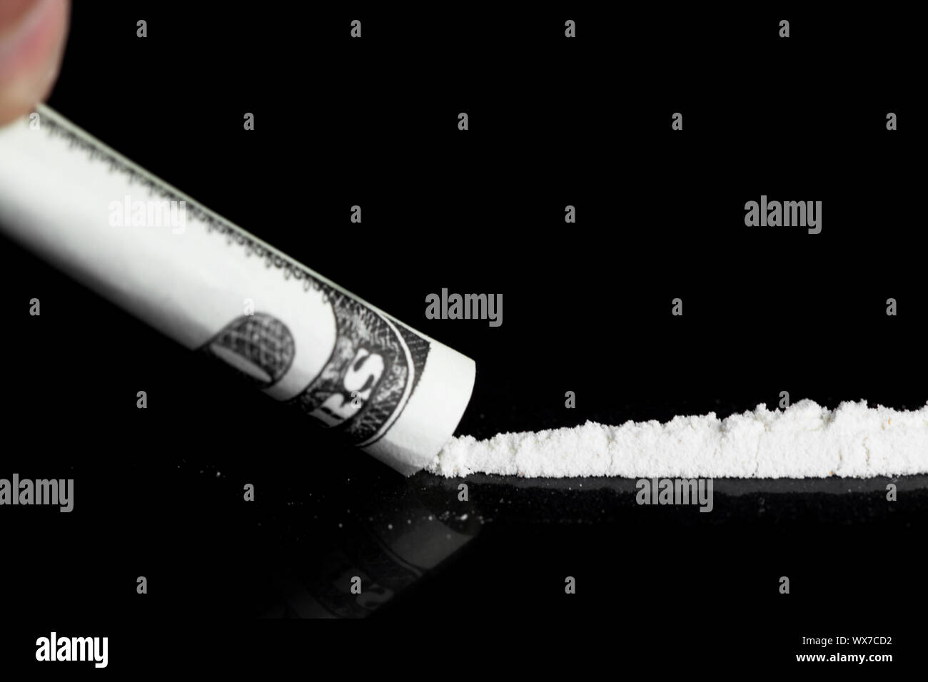 Person snorting a line of illegal white substance Stock Photo - Alamy