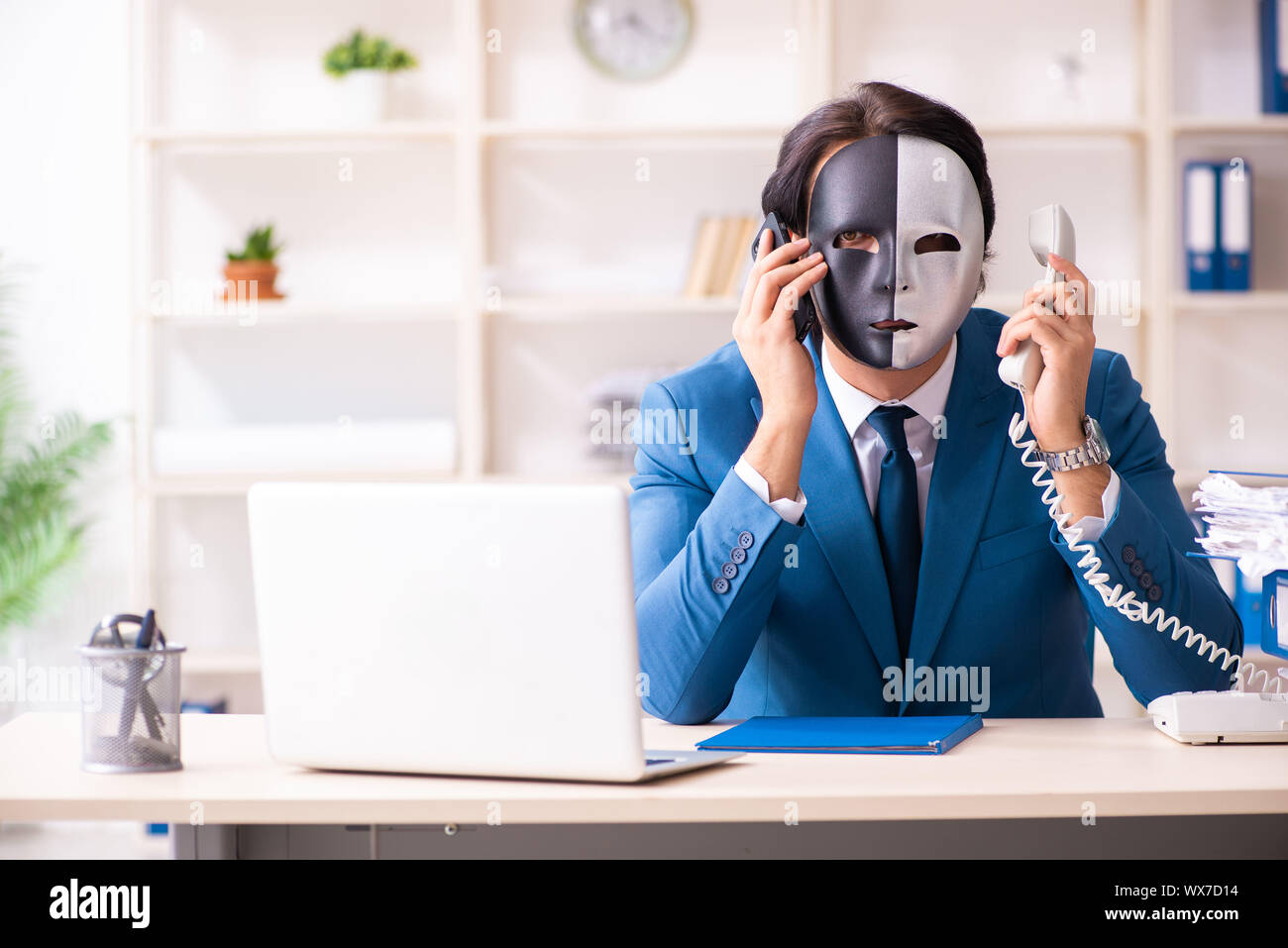 Male employee in the office in industrial espionage concept Stock Photo ...
