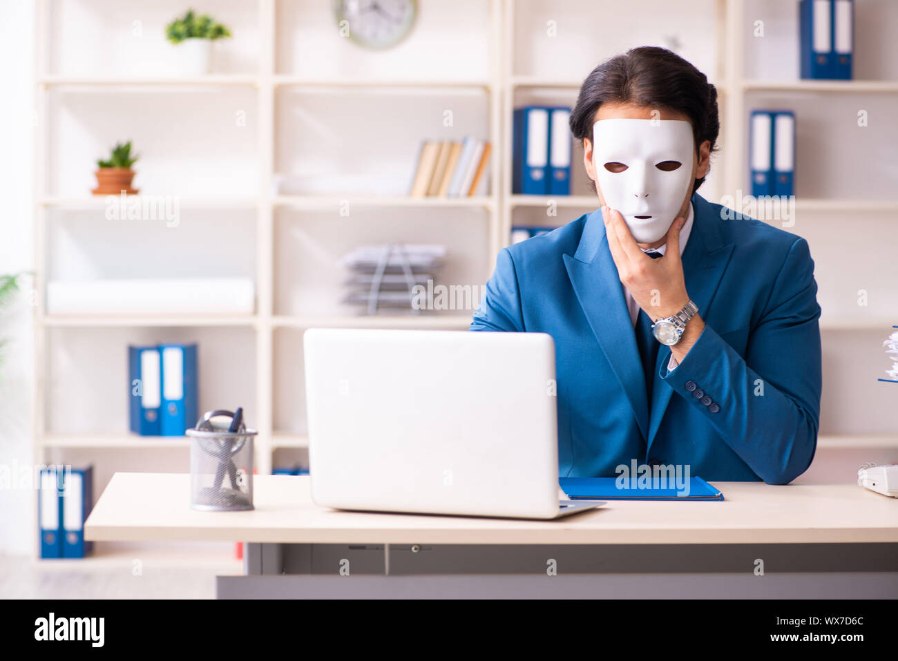Male employee in the office in industrial espionage concept Stock Photo ...