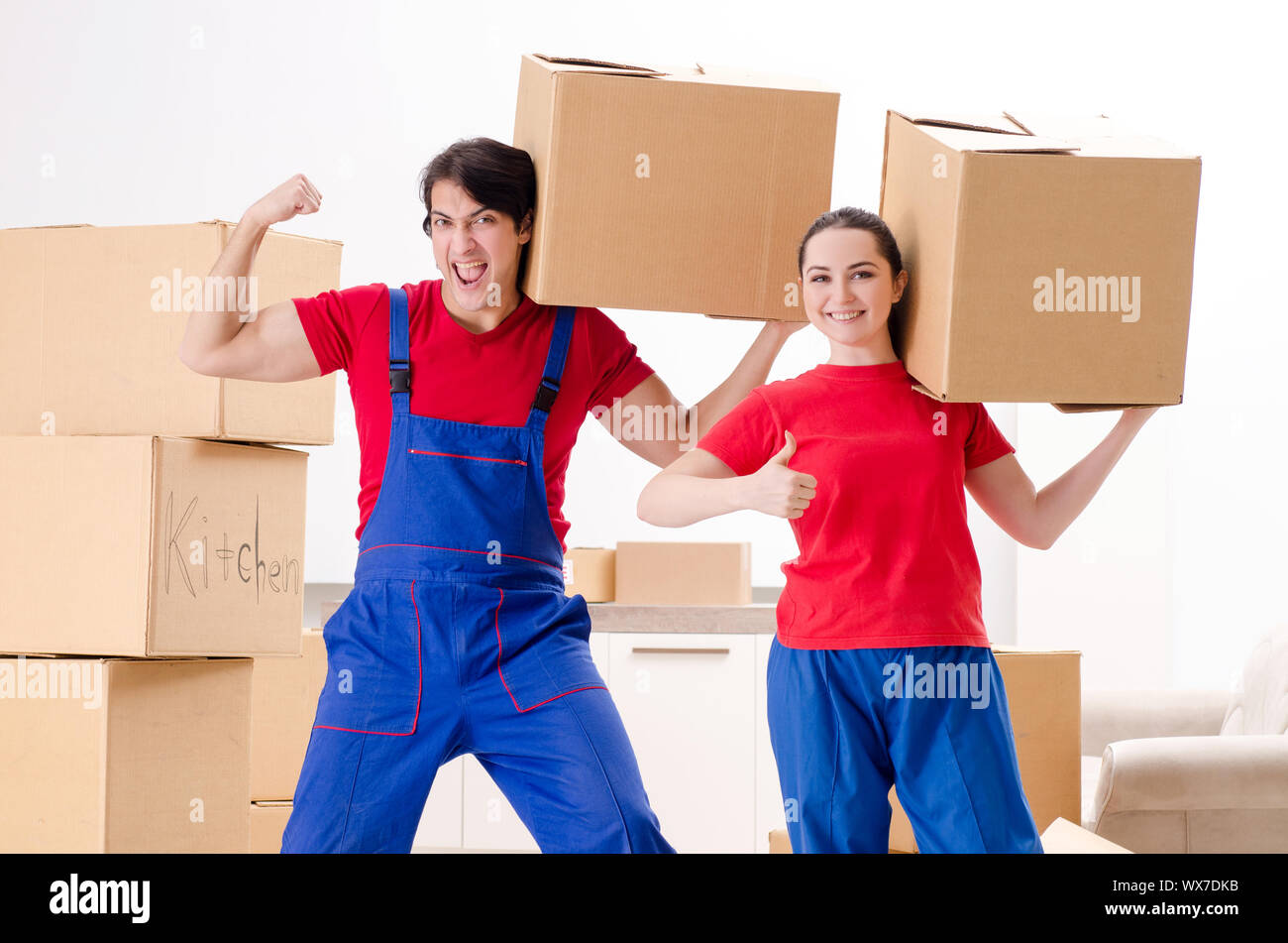Professional movers doing home relocation Stock Photo - Alamy