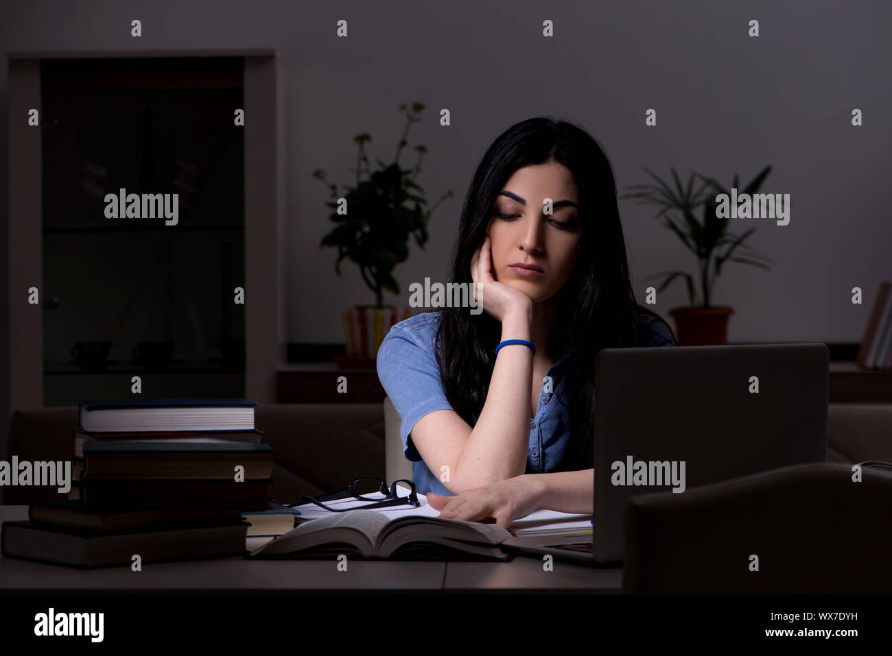 Young female student preparing for exams at night time Stock Photo - Alamy