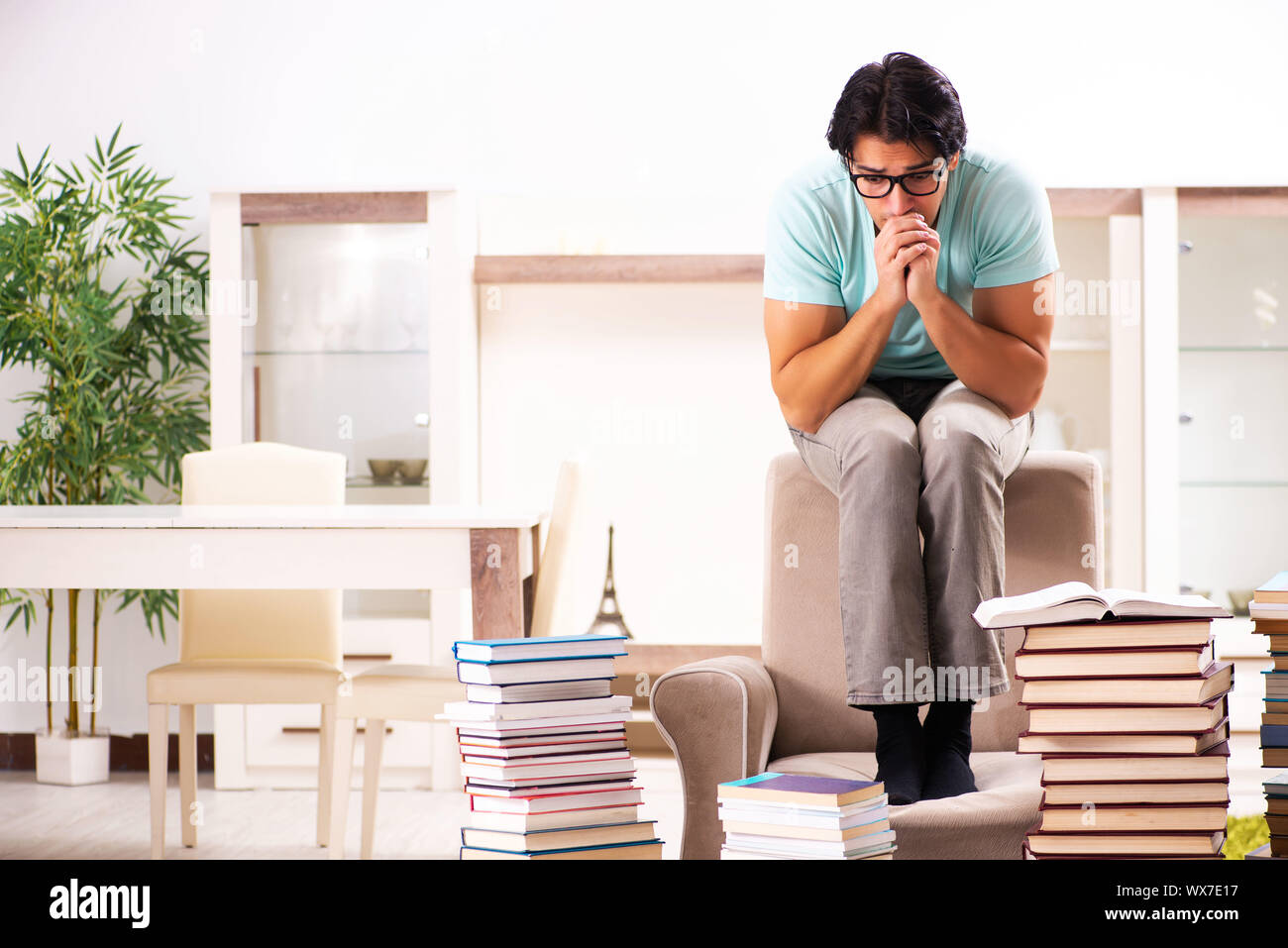 Stressed male teen with books hi-res stock photography and images - Alamy