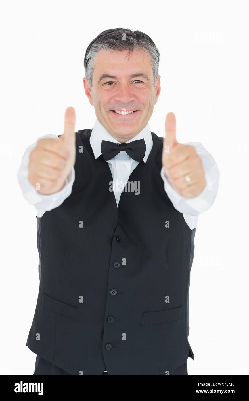 Happy Well-dressed man with thumbs up Stock Photo - Alamy
