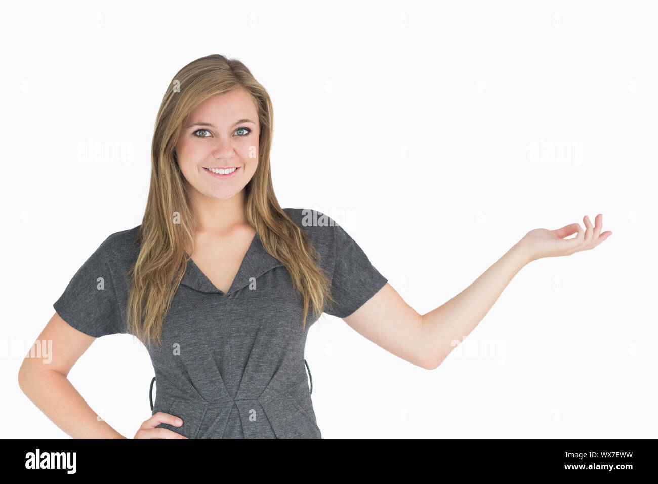 Woman presenting with her hand in the white background Stock Photo - Alamy