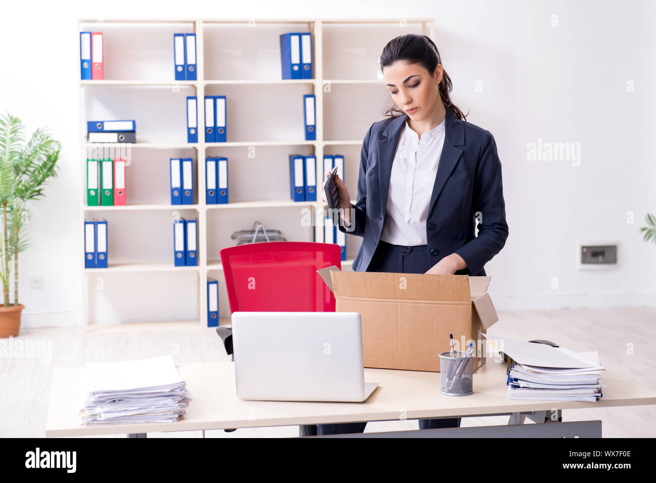 Young female employee being fired from her work Stock Photo - Alamy