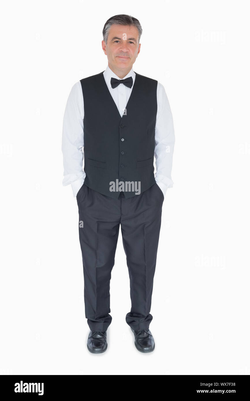 Waiter standing in uniform Stock Photo - Alamy