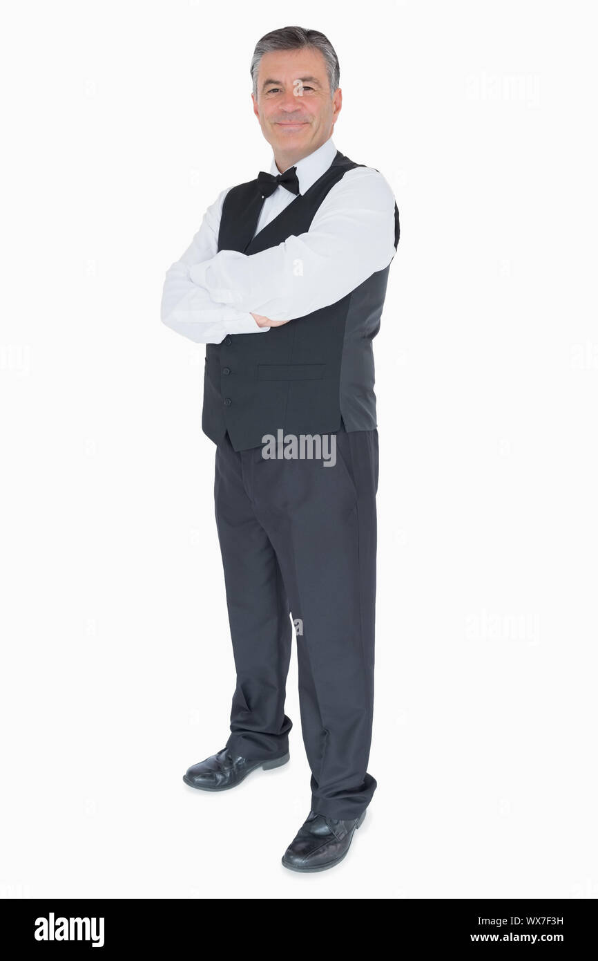 Smiling man in suit with crossed arms Stock Photo - Alamy