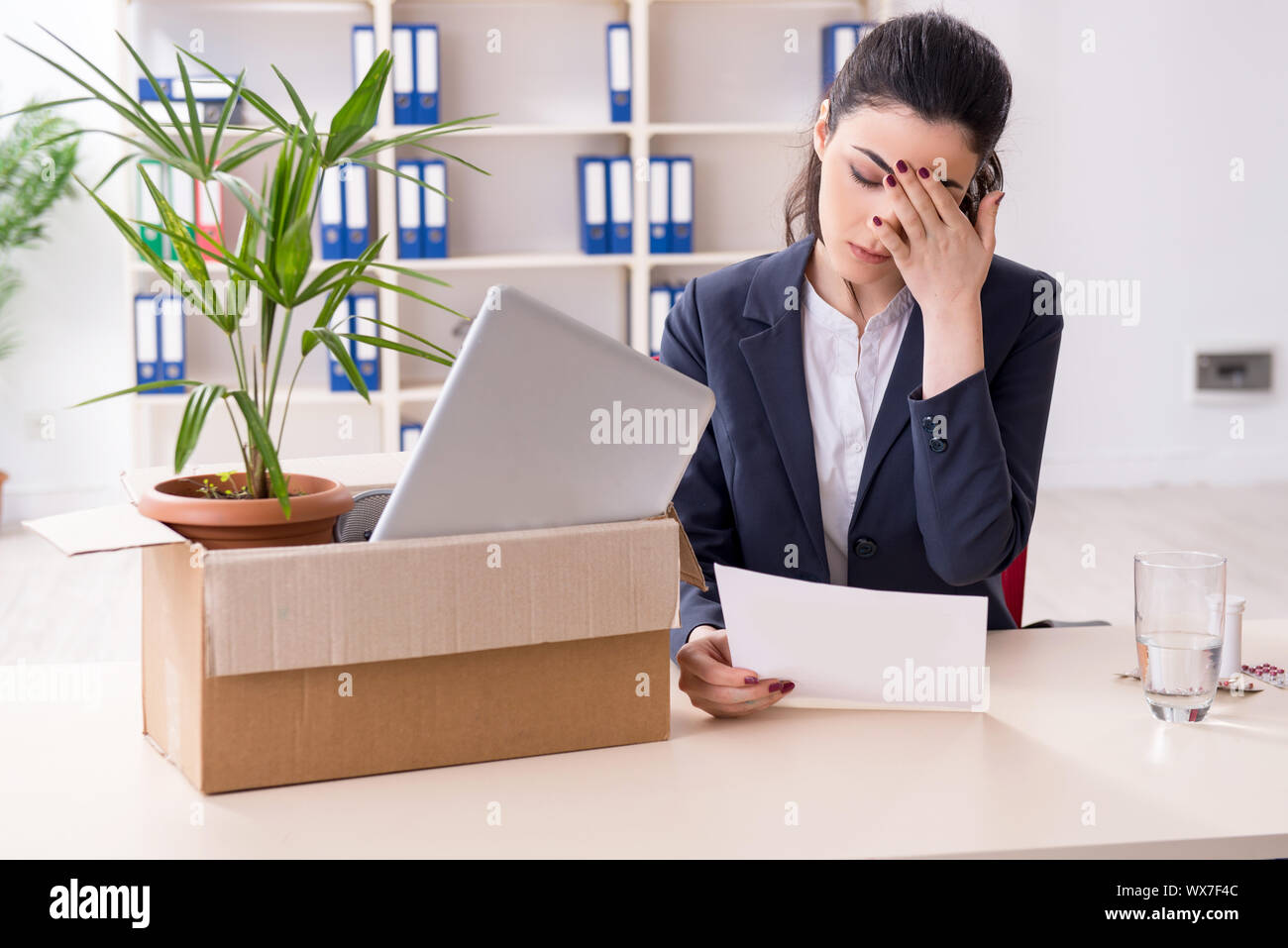 Young female employee being fired from her work Stock Photo - Alamy