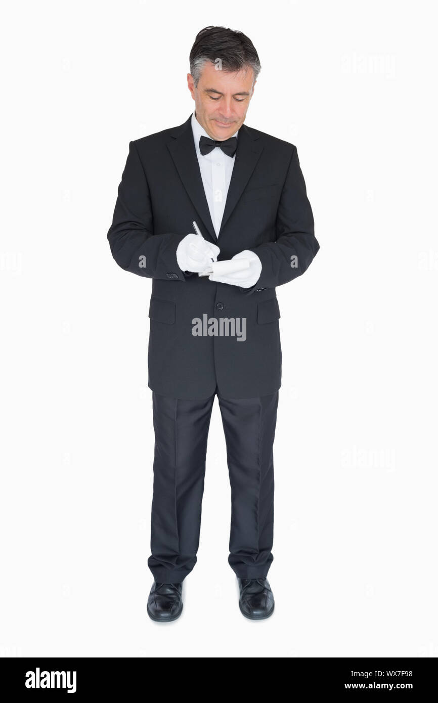 Waiter taking order in his notepad on white background Stock Photo - Alamy
