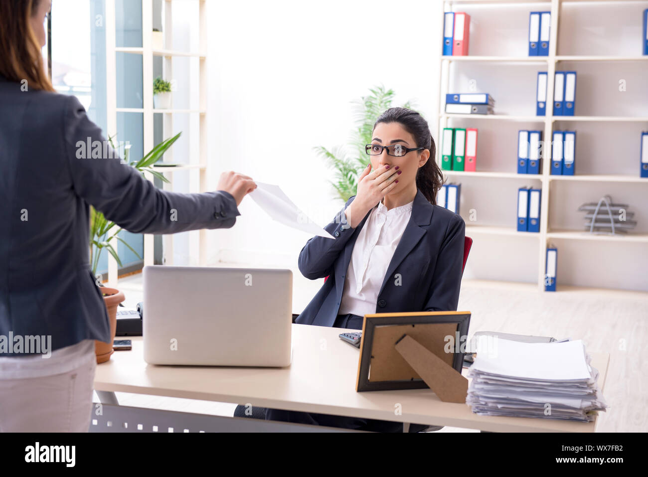 Young female employee being fired from her work Stock Photo - Alamy