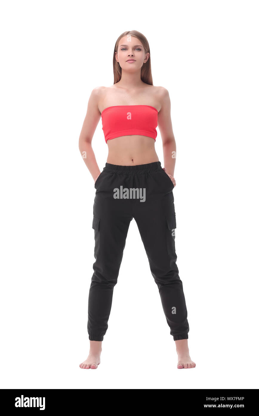 in full growth. portrait of a young fitness woman. isolated on white ...
