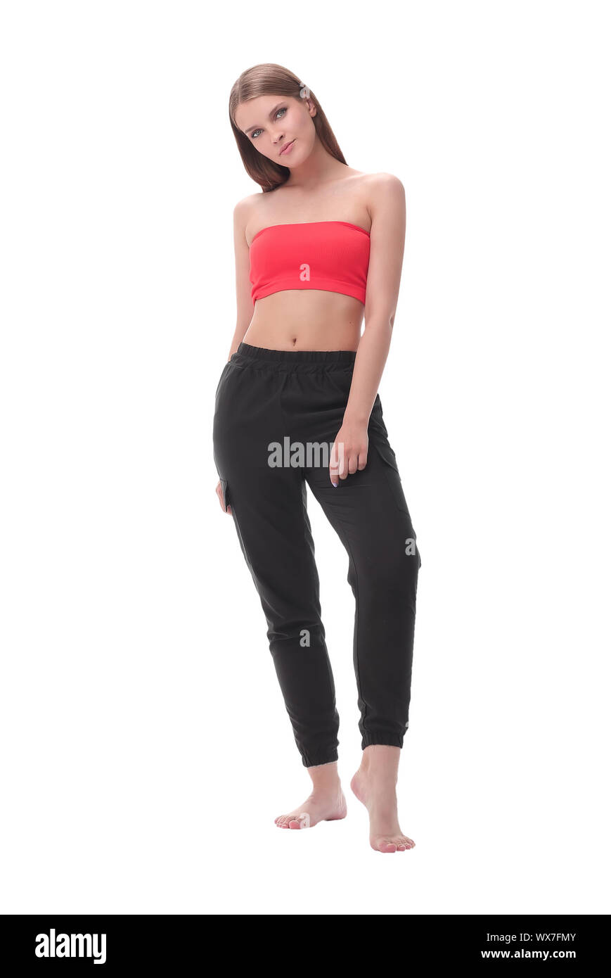 in full growth. portrait of a young fitness woman. isolated on white ...