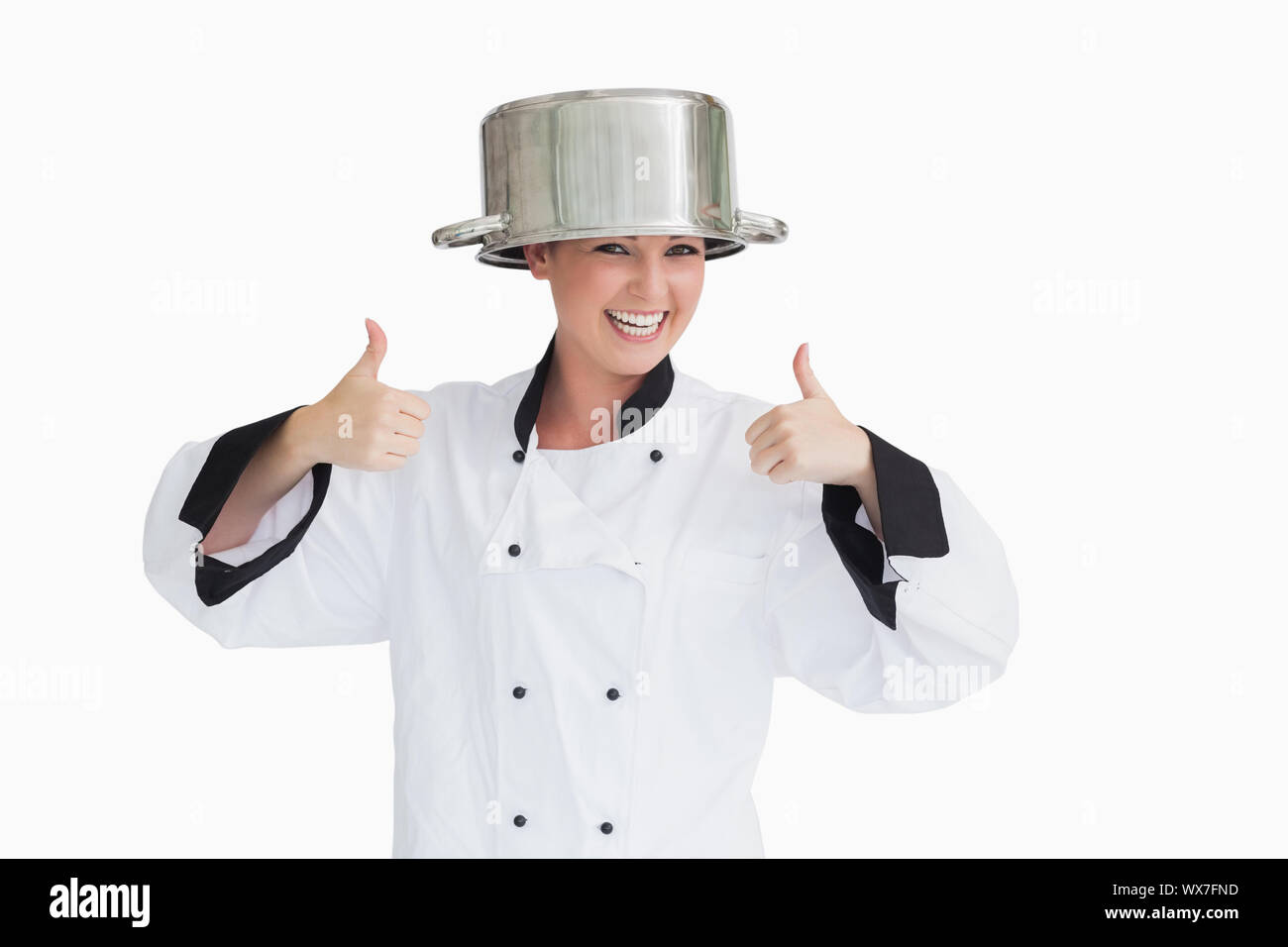 Cook having fun with a pot on her head and giving thumbs up Stock Photo ...