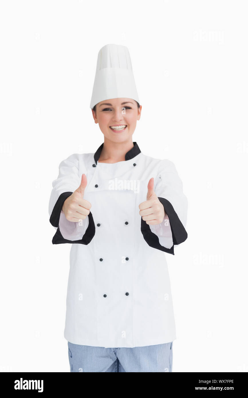 Cook having the thumbs up while looking at camera Stock Photo - Alamy