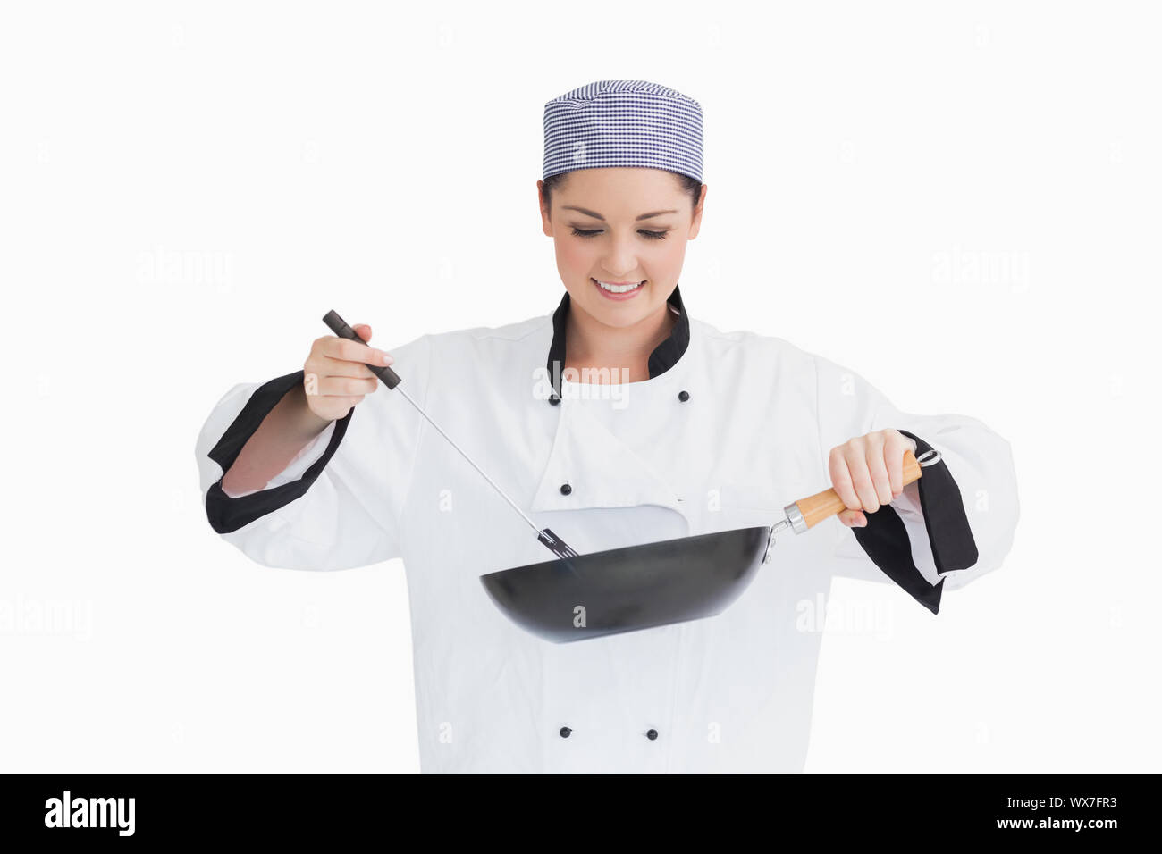 Cook cooking with wok and spoon on a white background Stock Photo - Alamy