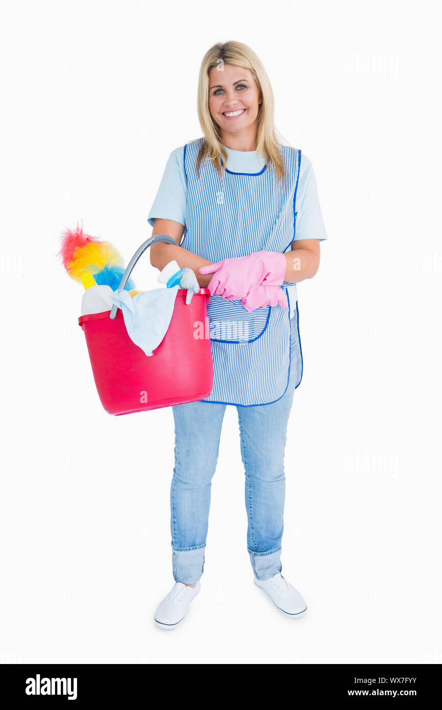 Smiling maid holding a pink bucket in the white background Stock Photo ...