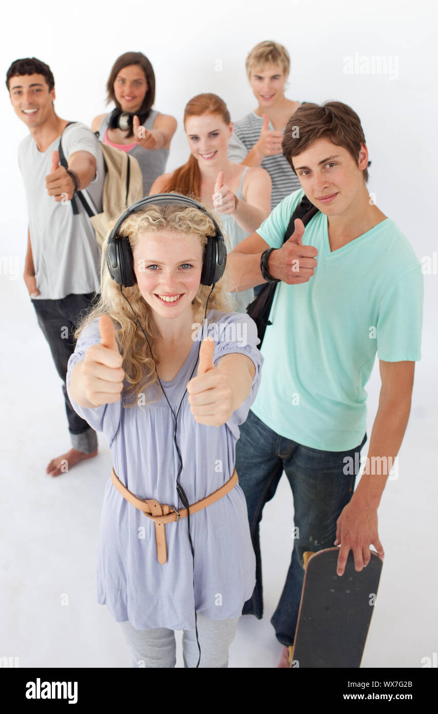 Happy teenagers smiling at the camera agaisnt white background Stock ...