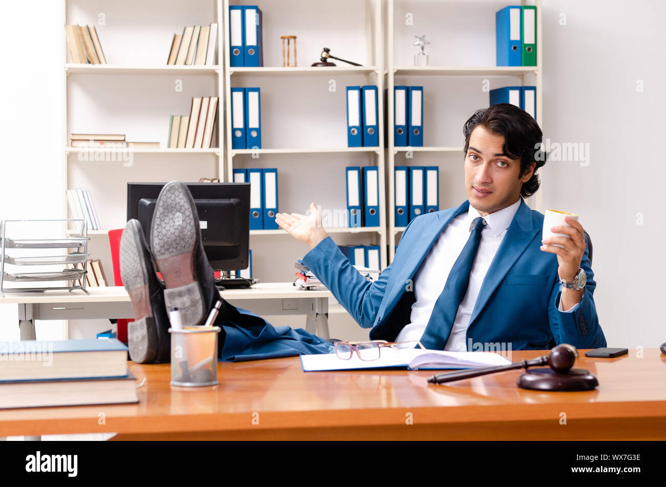 Young handsome judge sitting in courtroom Stock Photo - Alamy