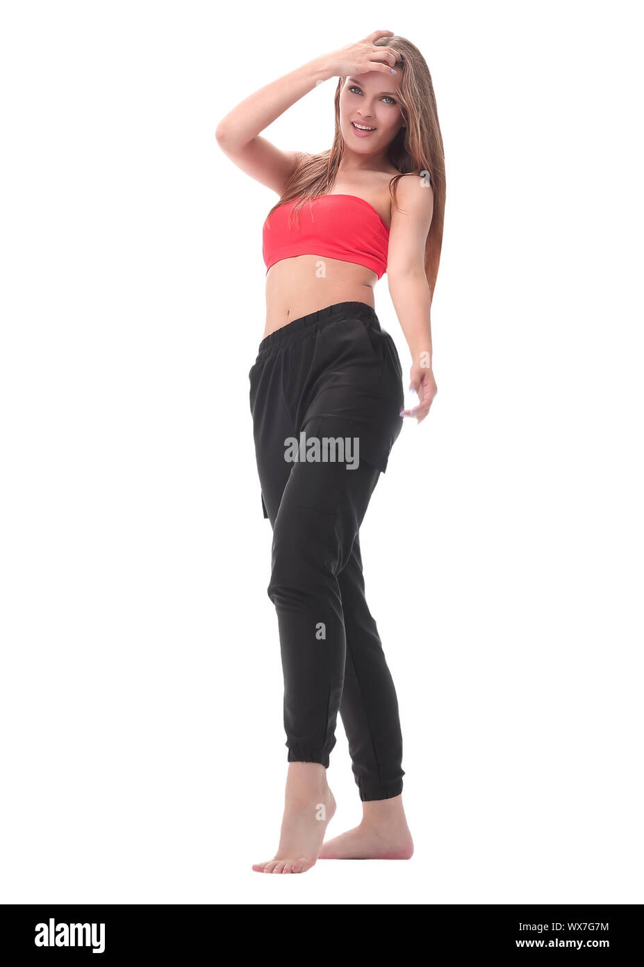 in full growth. beautiful girl performing fitness exercises. isolated ...