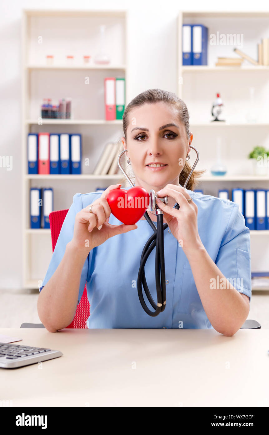 Female doctor cardiologist working in the clinic Stock Photo - Alamy