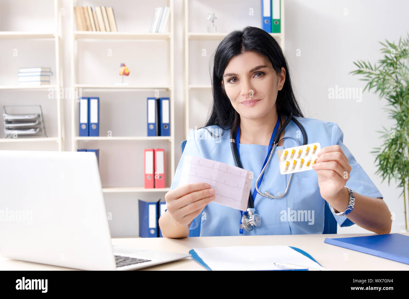 Female doctor cardiologist working in the clinic Stock Photo - Alamy