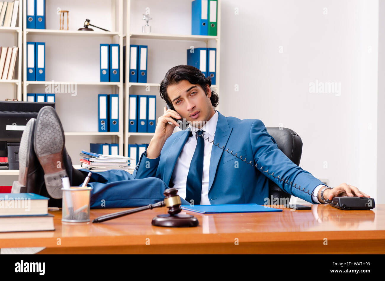 Young handsome judge sitting in courtroom Stock Photo - Alamy