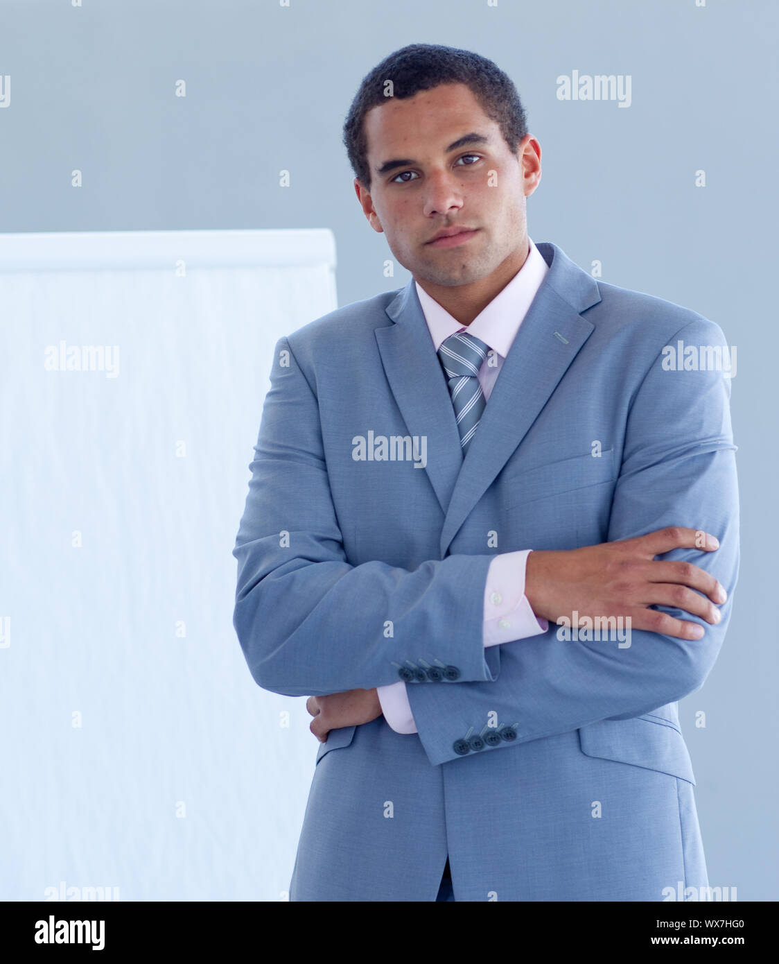 Serious young businessman giving a presentation to his team Stock Photo ...