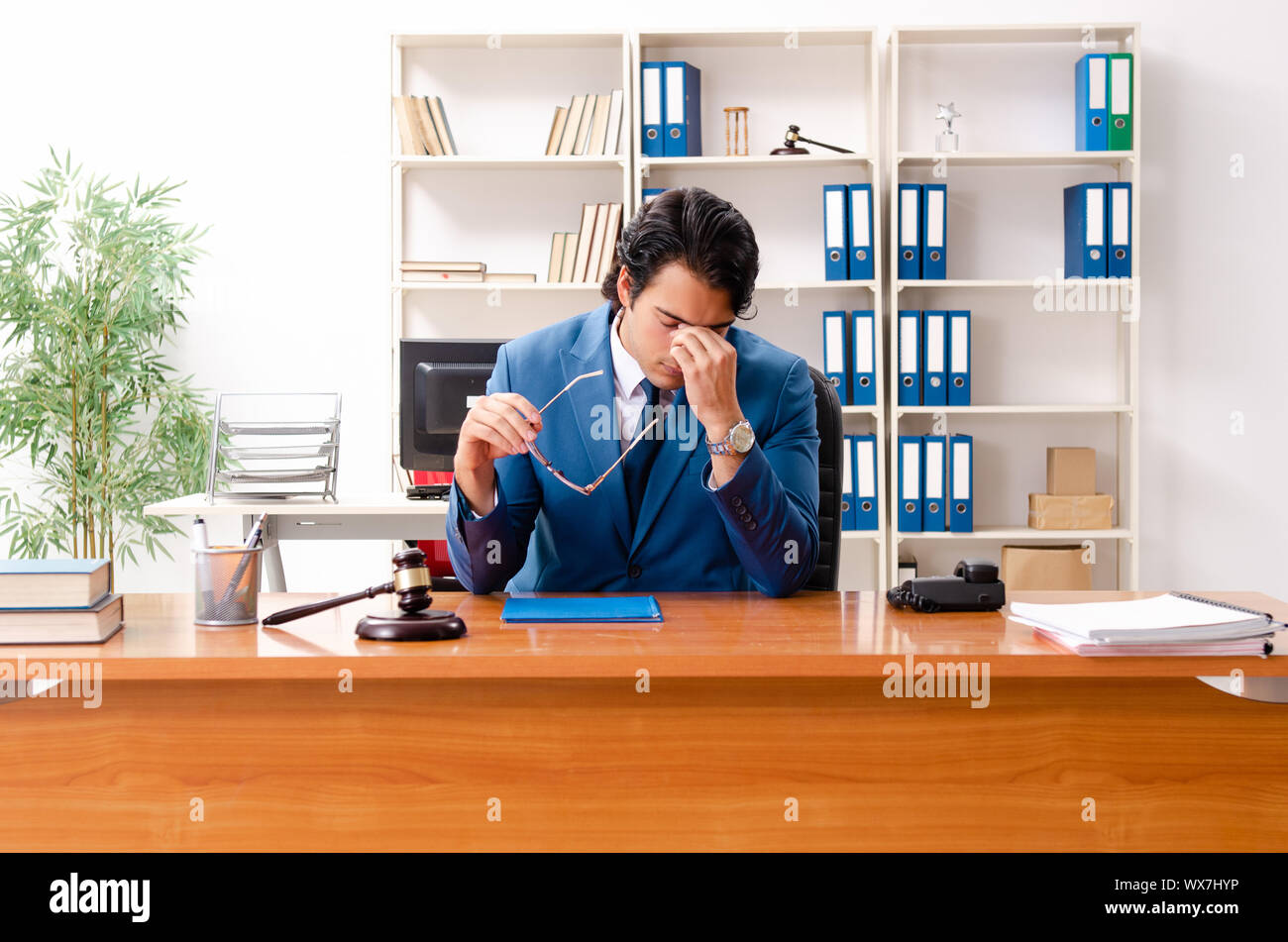 Young handsome judge sitting in courtroom Stock Photo - Alamy