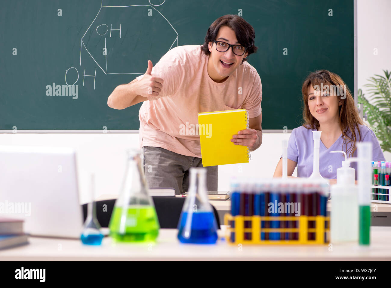 Two chemists students in classroom Stock Photo - Alamy