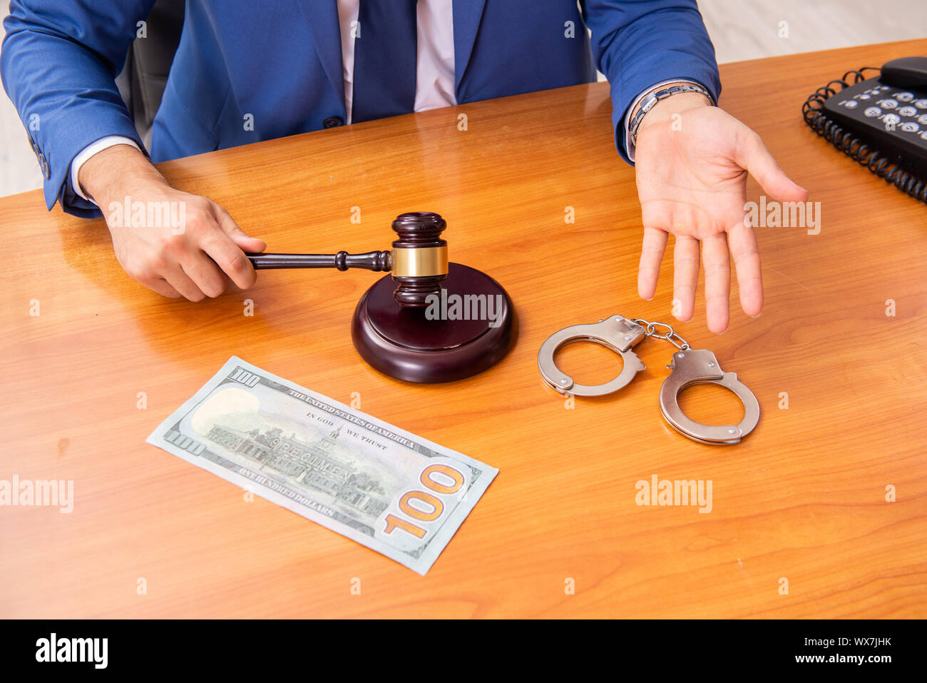 Young handsome judge sitting in courtroom Stock Photo - Alamy