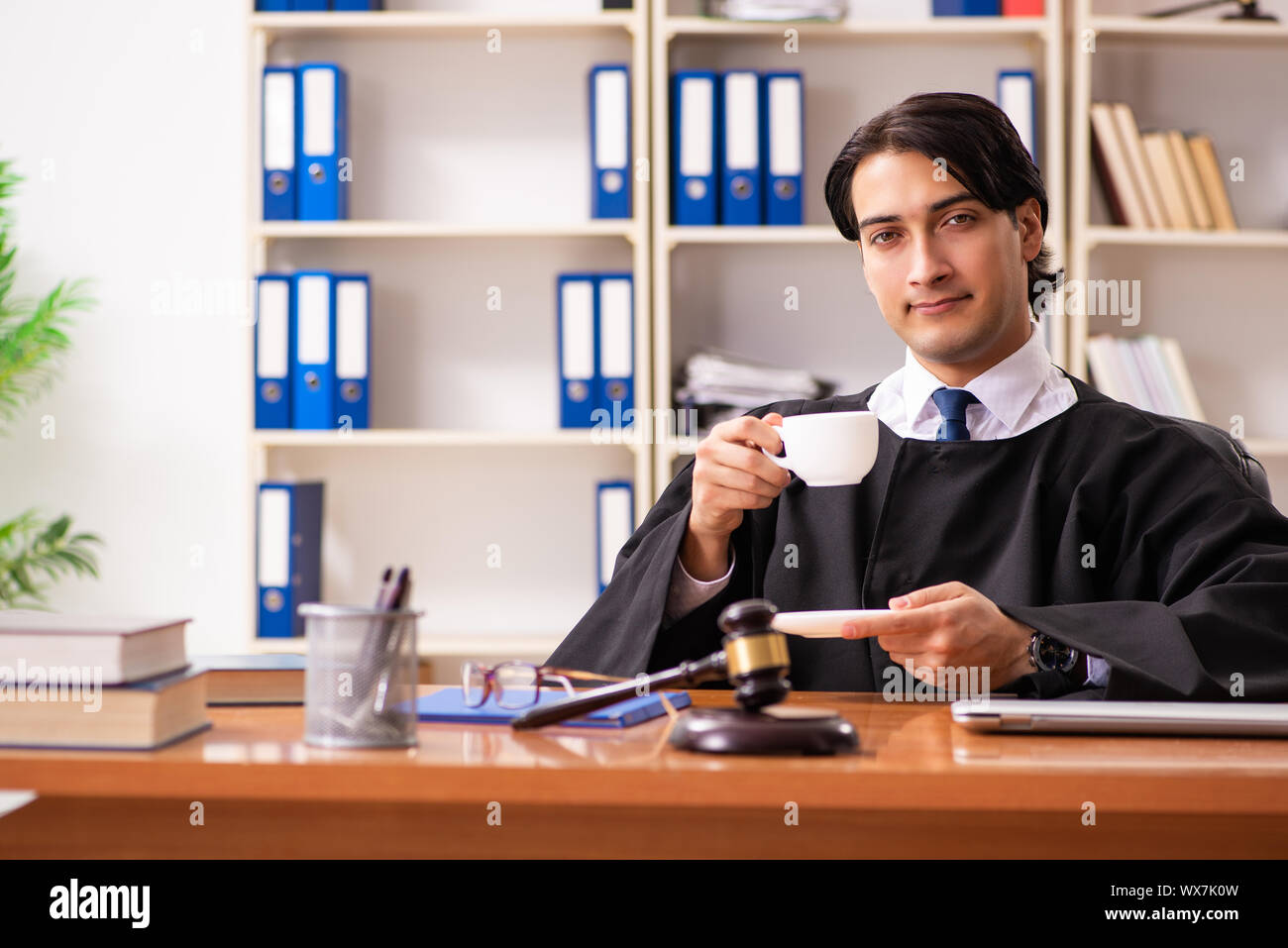Young handsome judge working in court Stock Photo - Alamy