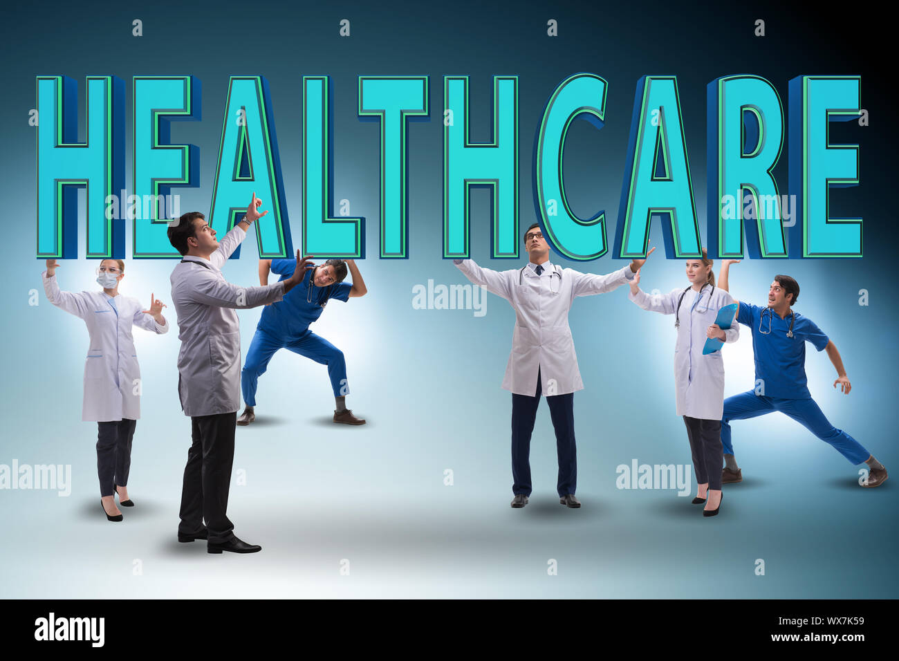 Group of doctors holding healthcare letters Stock Photo - Alamy